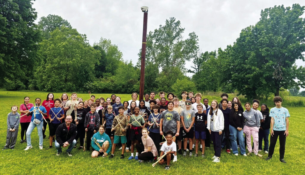 Stickball pole installed - Eastern Times Register